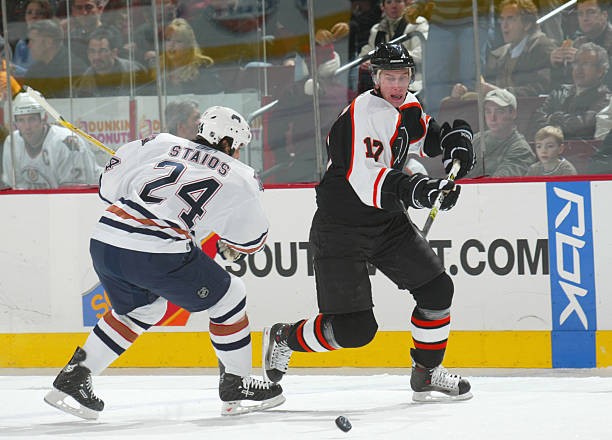 Jeff Carter Philadelphia Flyers skates for the puck at the g- Ice ...