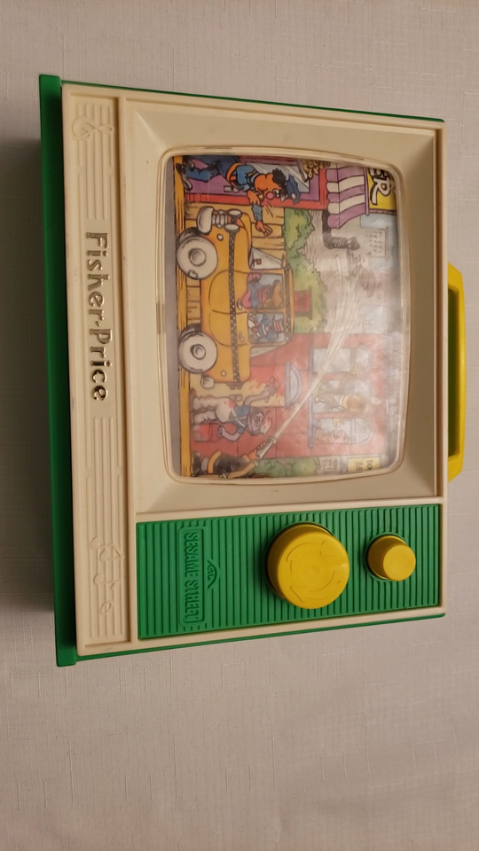 FISHER PRICE SESAME STREET WIND UP SCROLLING SCENES MUSIC TV BOX video ...