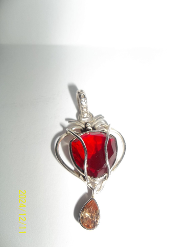 caged ruby red &golden qrtz aprox. 1 3/4" long aprox. 1" wide 6grms | eBay