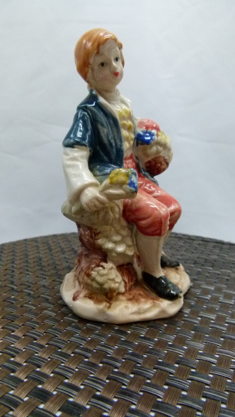 Porcelain Figurine boy sitting with a basket of flowers | eBay