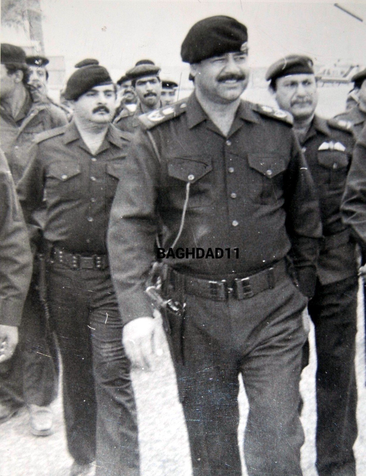 Reprinted photo of Saddam in an official meeting, Iraqi-Irani war era ...