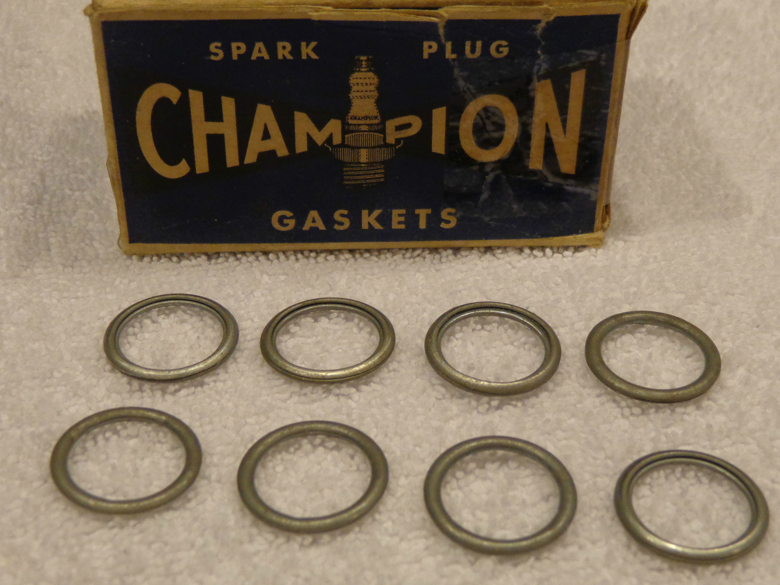 (8) ... ‘NOS’ Champion 18mm Spark Plug Gaskets ... Steel ... Made in ...