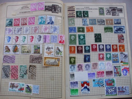 PART FILLED WORLDWIDE GLOBE MASTER STAMP ALBUM WITH A COLLECTION OF ...