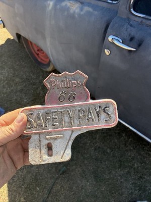 PHILLIPS 66 "SAFETY PAYS" LICENSE TAG Topper CAST IRON Gas Oil ...