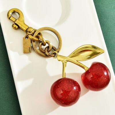 Coach Cherry Bag Charm KeyChain Glitter resin and metal Brass/Red Apple ...