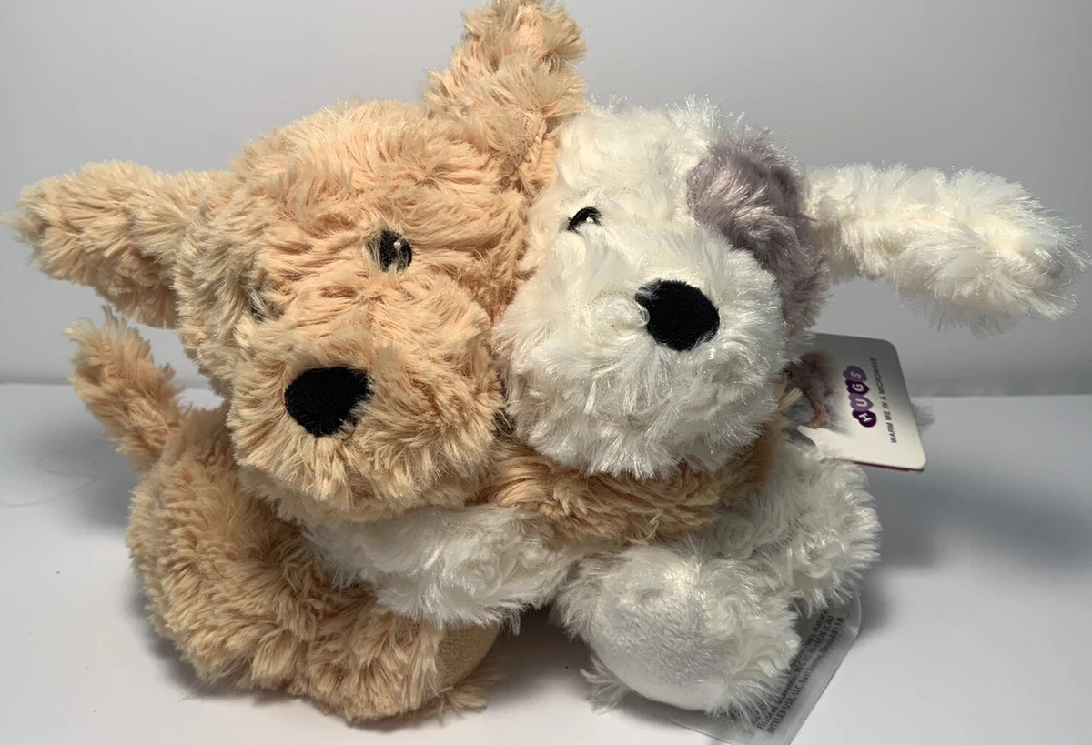 Puppies Cuddling With Stuffed Animals