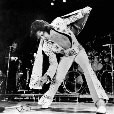 Elvis Presley classic 1970's in concert in open jump suit on stage ...