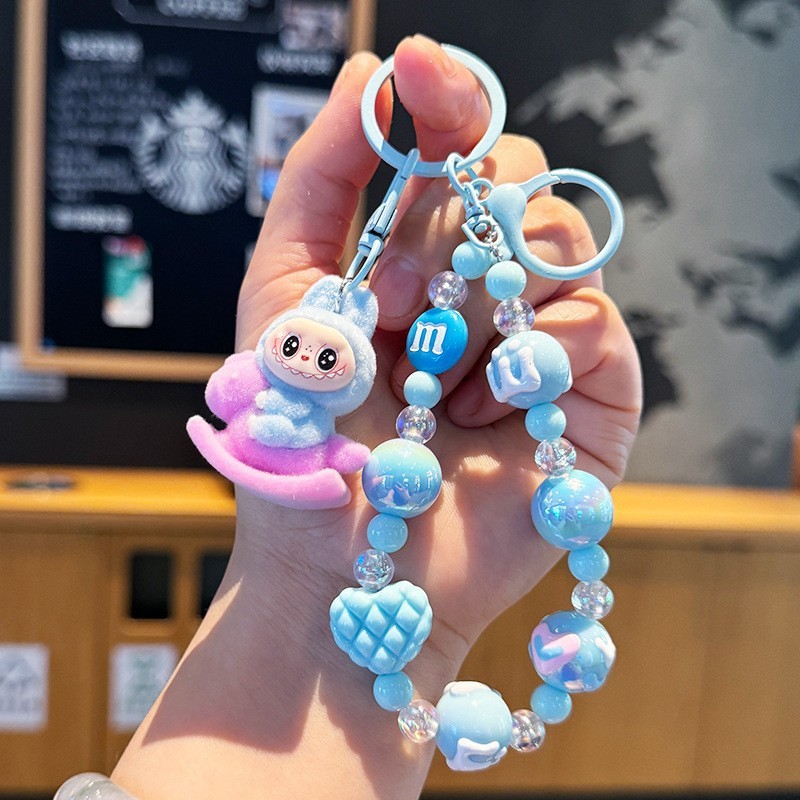 Cute Figure Doll Keychain with String of Beads on Hobbyhorse Bag ...
