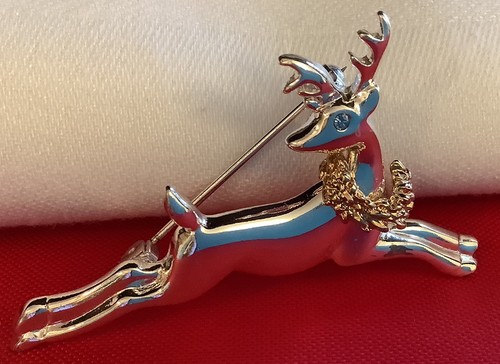 Reindeer silver-tone 2.5” (with gold-tone wreath. Blue crystal eye ...