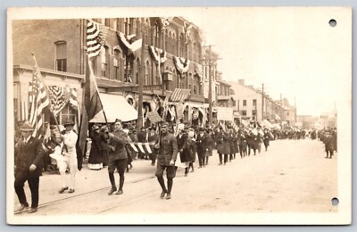 Postcard WW1 Parade? Military Soldiers Busy Street Scene (two holes ...