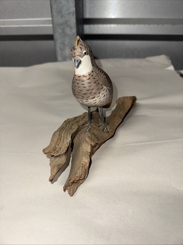 Quail or partridge - hand carving on a wooden base. The legs are made ...