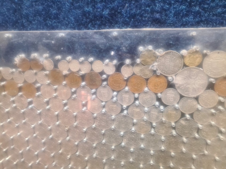 approximately, 675 vintage Coins in unusual Perspex sheet holder ...
