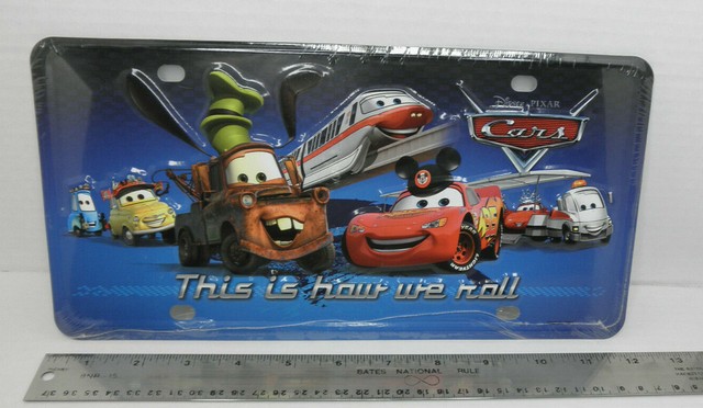 Walt Disney World Pixar CARS Metal License Plate "THIS IS HOW WE ROLL ...
