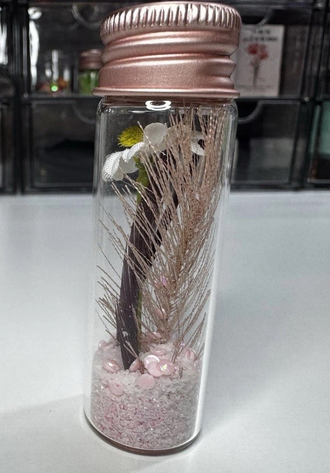 Small Glass Vile With Artificial Daisy In White Sand And Pink Glitter ...