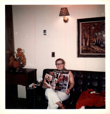 Woman Holding Christmas Present on Lap Sitting on Couch Vintage Photo ...