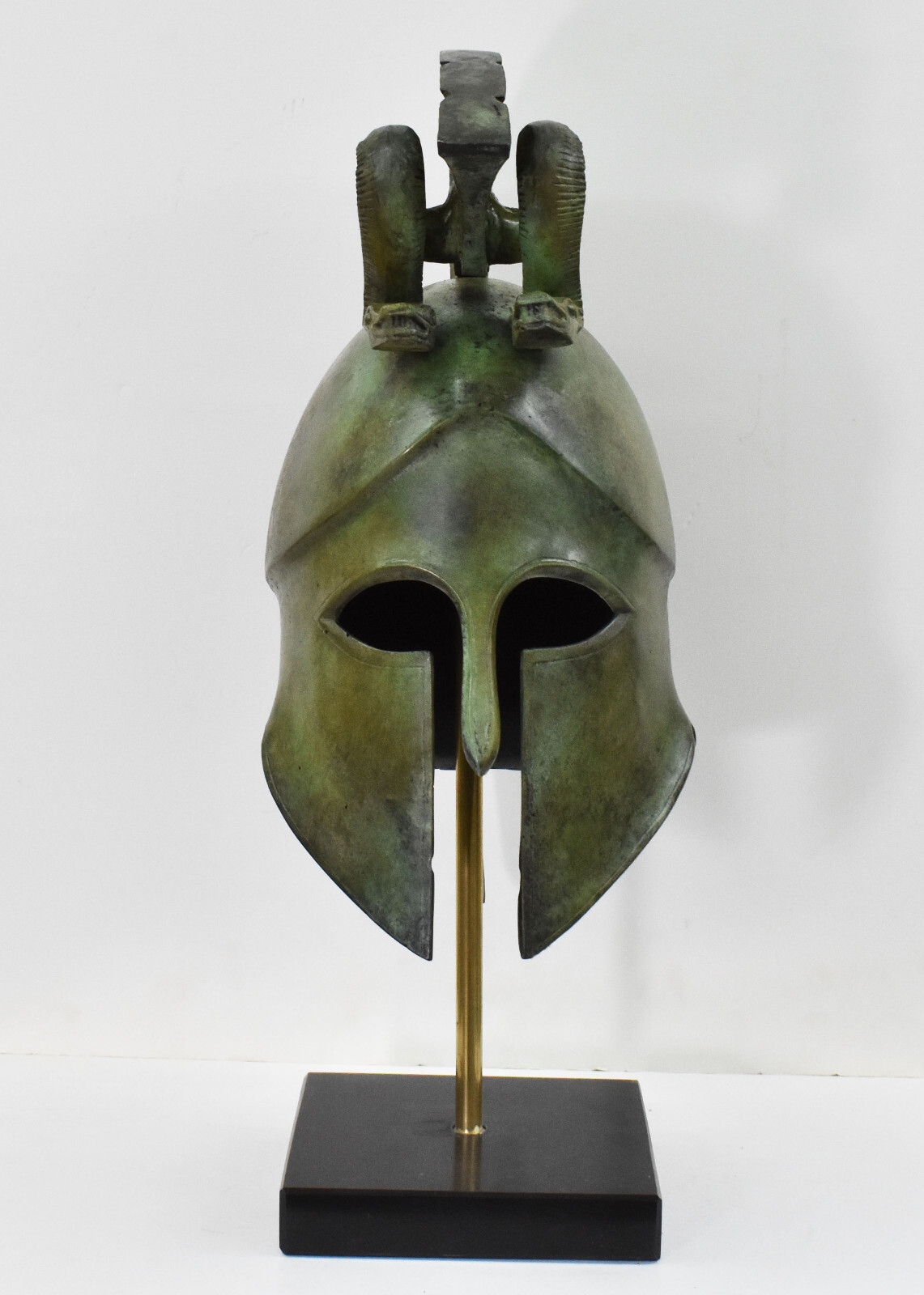 Corinthian bronze helmet with snakes on marble base - Hoplite soldier ...