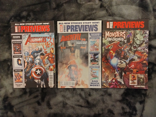 Three preview comic books and a music group poster that are in pretty ...