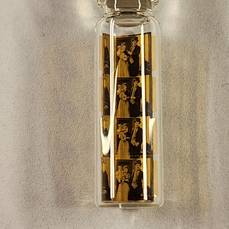 charlie chaplin vintage film cells . strip inside a vial, pouch and ...