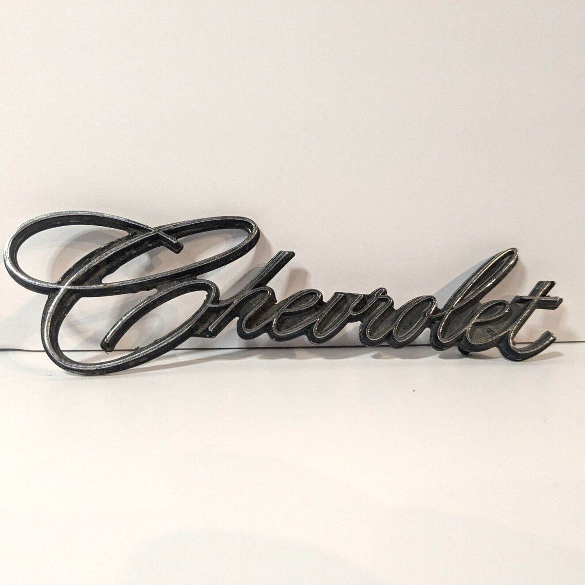 Vintage Cursive Chevrolet Logo NOS ! Central Chev Olds Dealer Emblem
