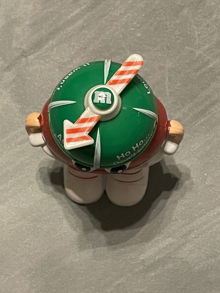 M&M Red Figure Dispenser Arrow Spinner Hat Christmas | eBay