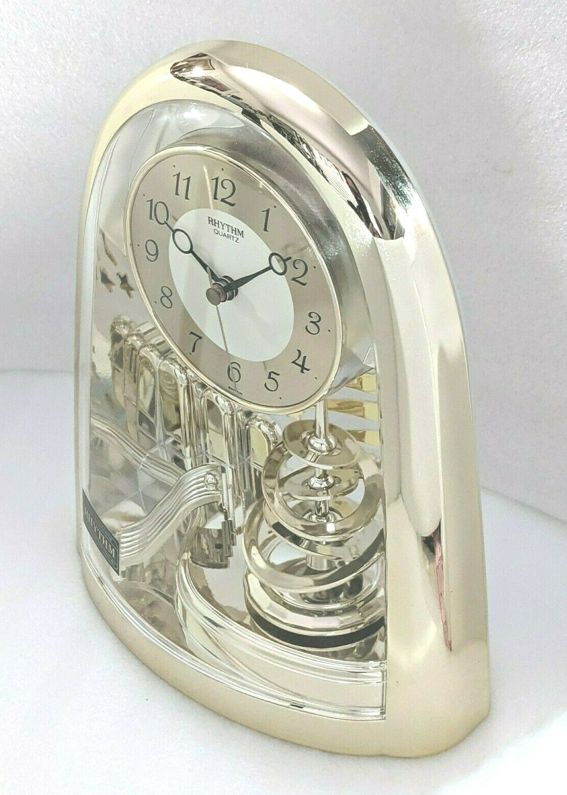 WW. RHYTHM Contemporary Motion Desk Clock Rotating Pendulum Gold Color ...