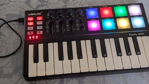 Worlde Panda Mini 25-Key Portable USB Keyboard Drum Pad Controller w ...