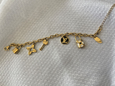 LOUIS VUITTON Gold Charm Bracelet LV Charms Clover key locket engraved ...