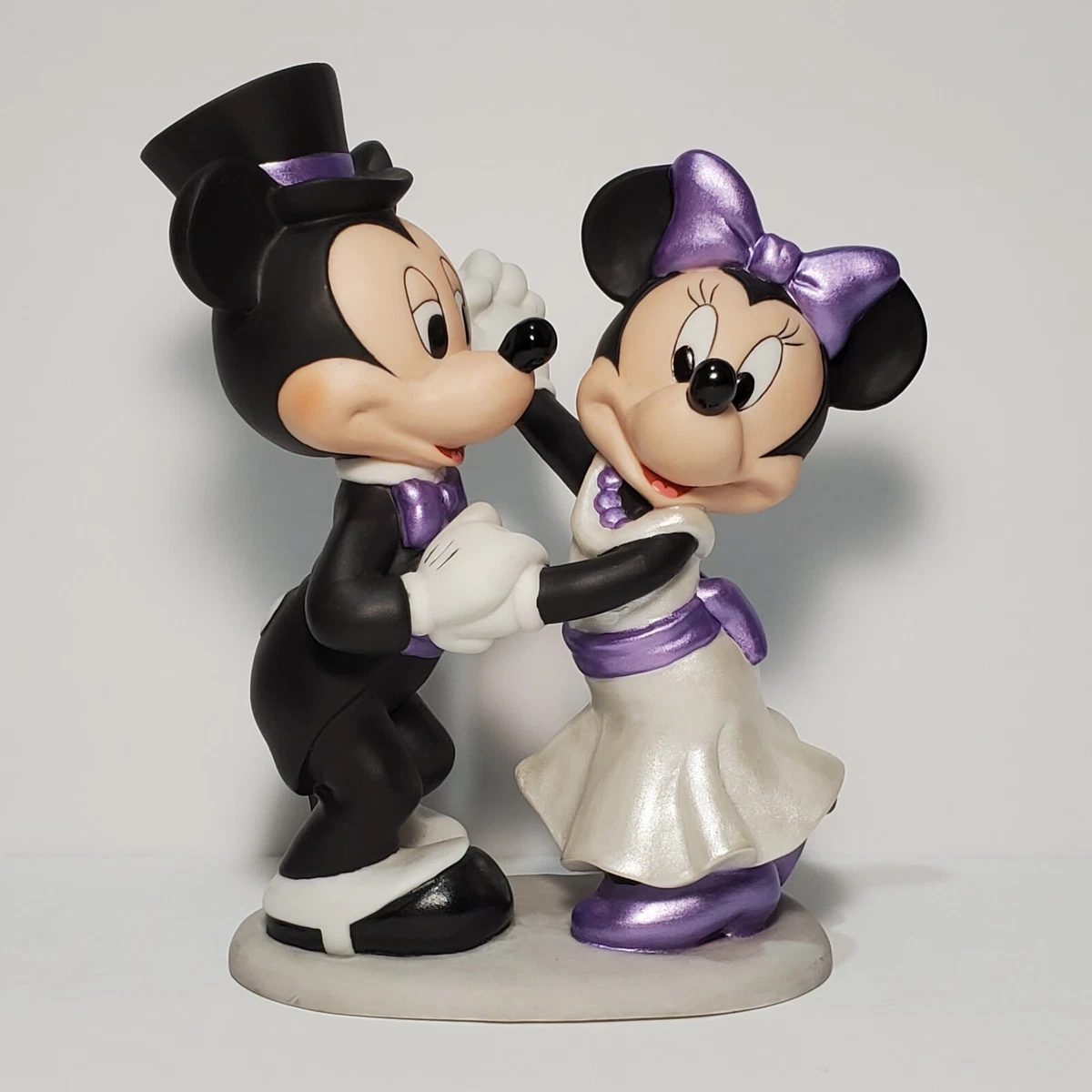 Mickey And Minnie Mouse Holding Hands