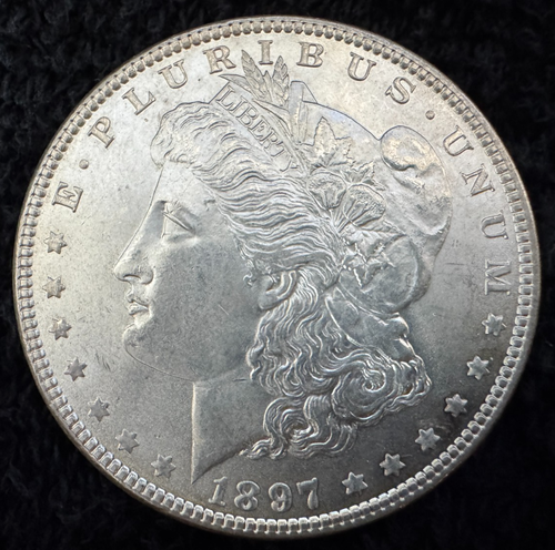 Hi grade BU 1897 Morgan silver dollar. Great breast feathers and ...