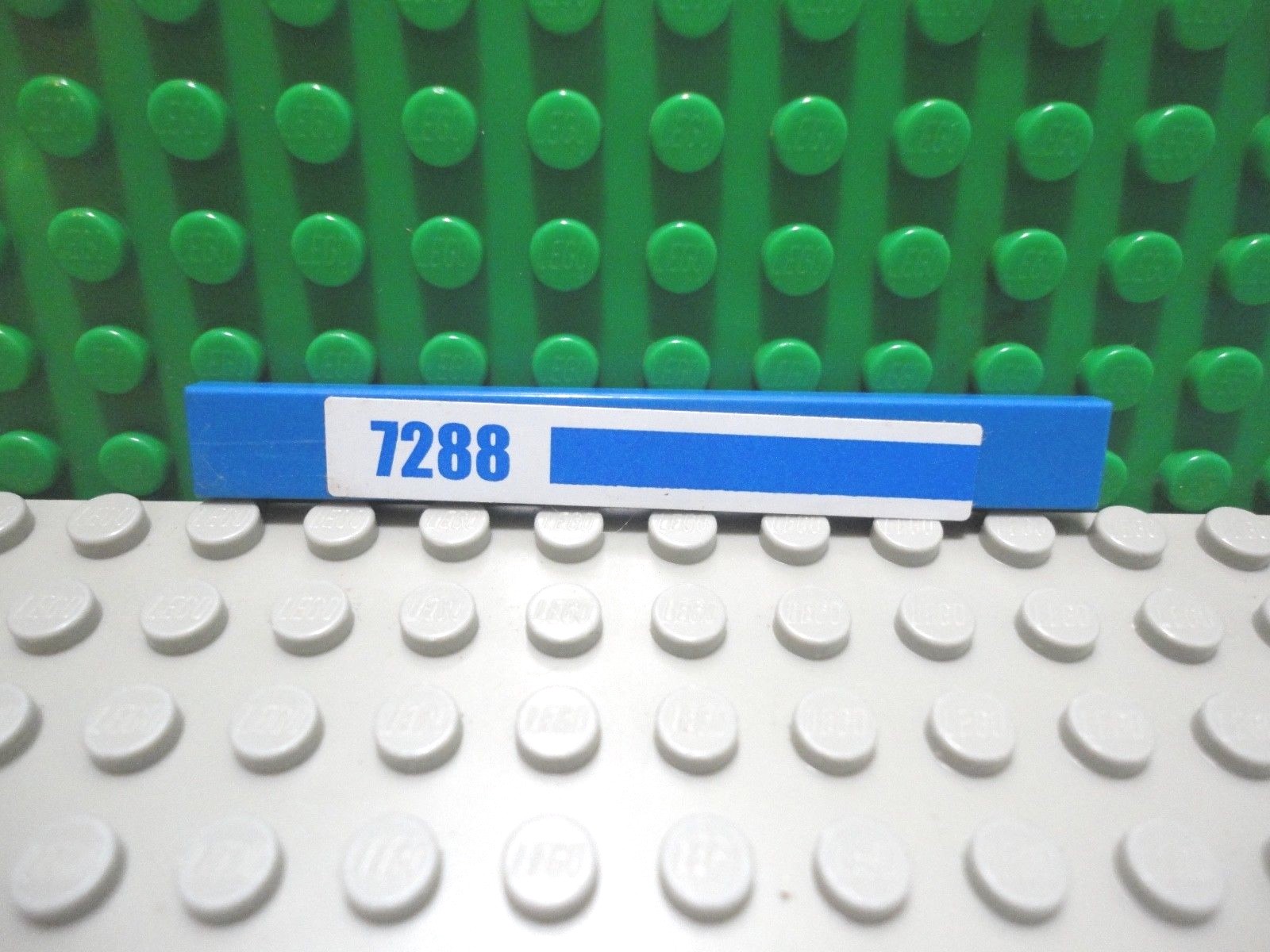 Lego 1 Blue 1x8 finish tile with sticker of 7288 | eBay