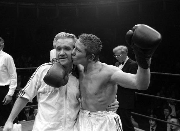 Boxing British Welterweight boxer Dave "Boy" Green kisses his mana- Old ...