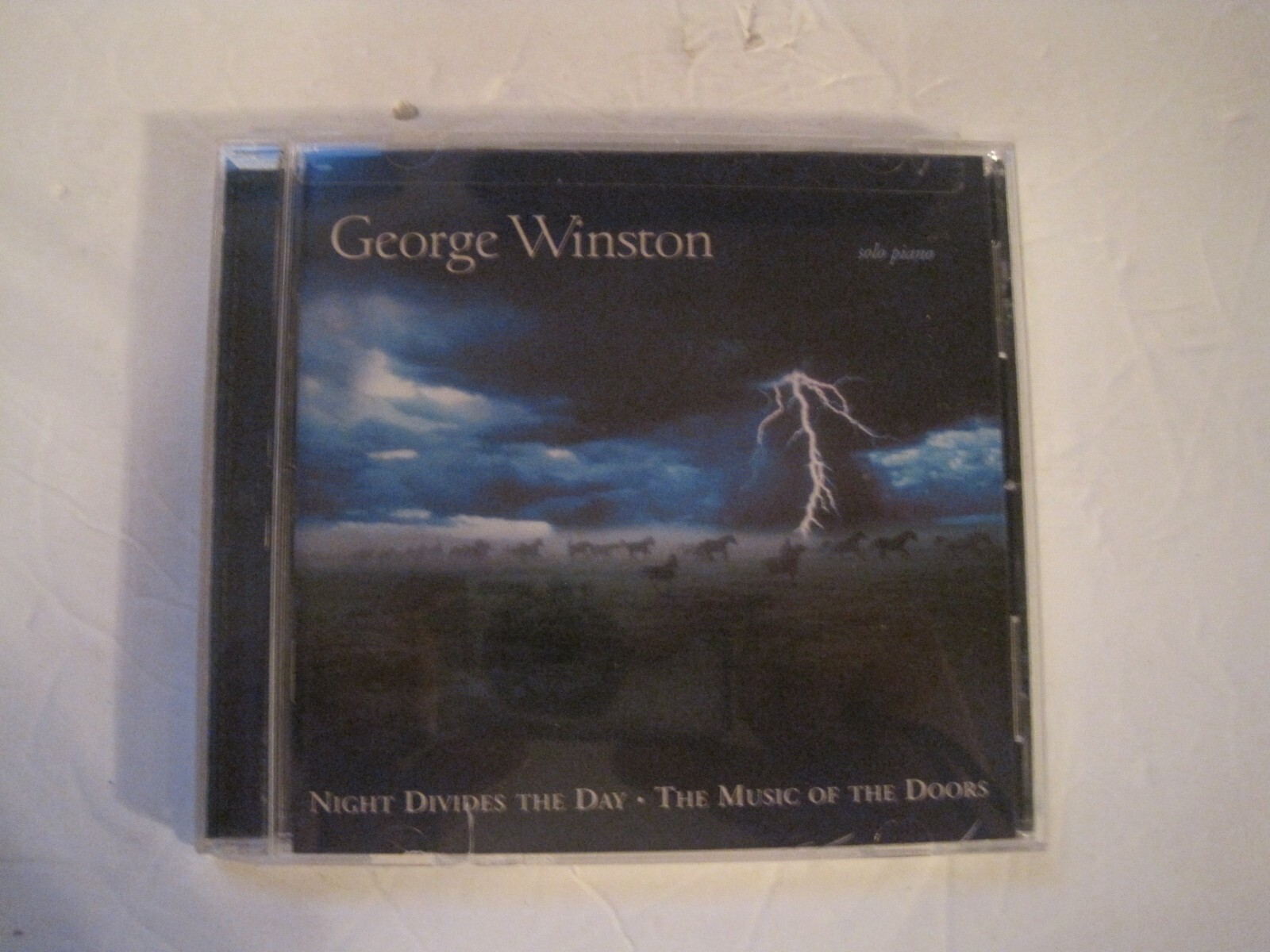 Winston, George : Night Divides the Day: The Music of the CD ...