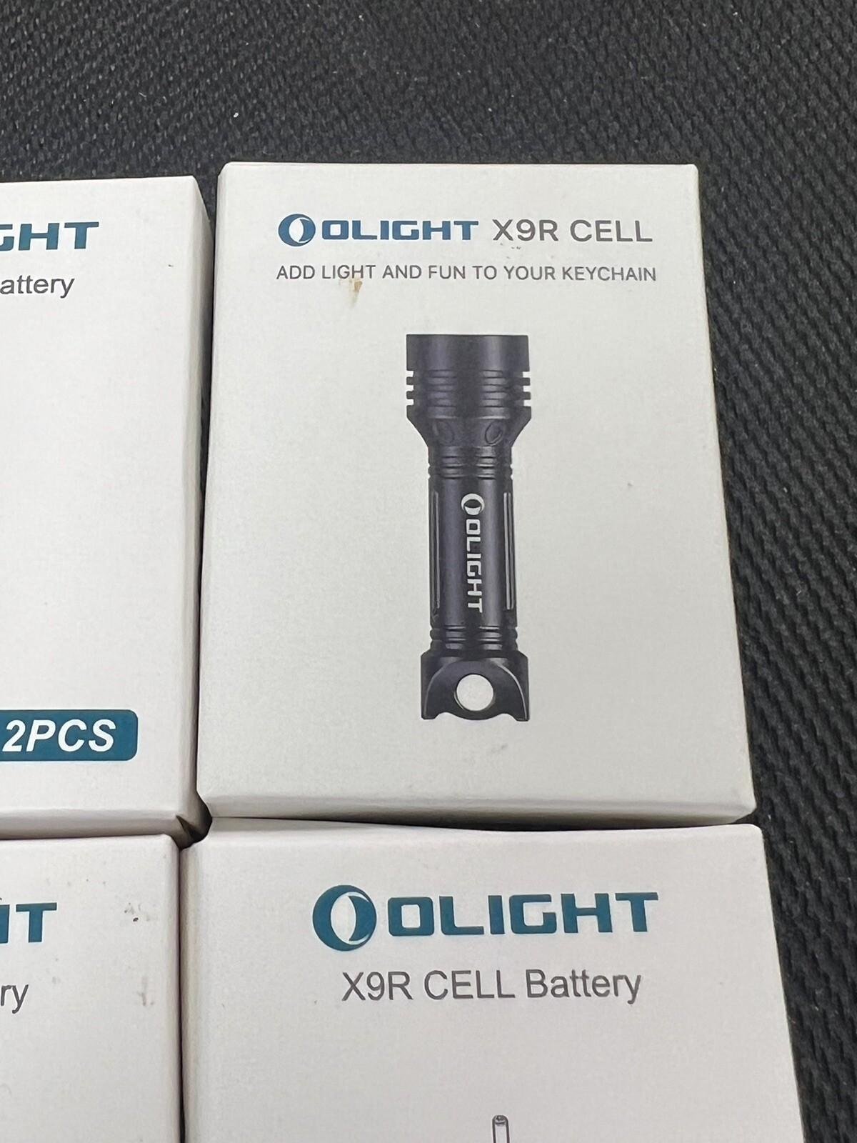 Olight X9R Cell 2.5 Lumen Keychain Torch + 3 Packs Spare Pair Of ...