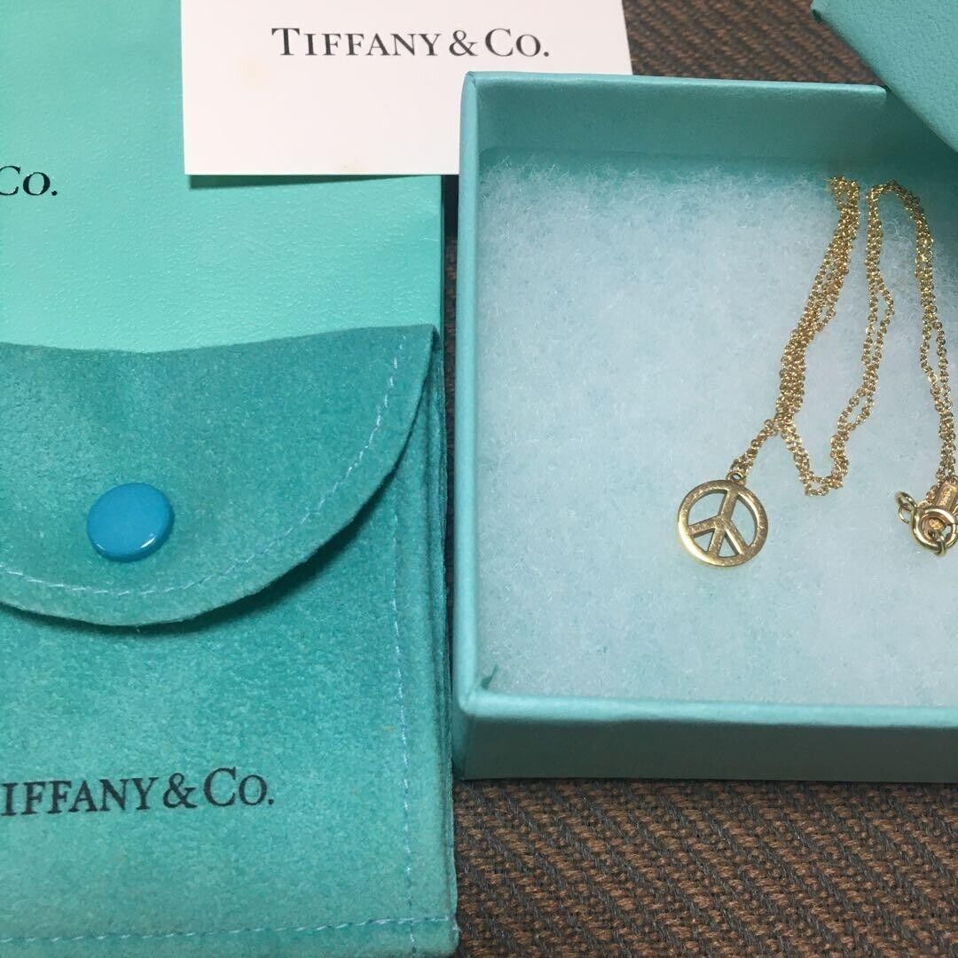 Tiffany 18K gold necklace peace mark #36 | eBay