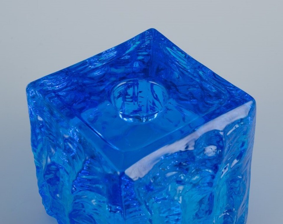 Gullaskruf, Sweden. Square-shaped glass vase and candlestick in blue ...