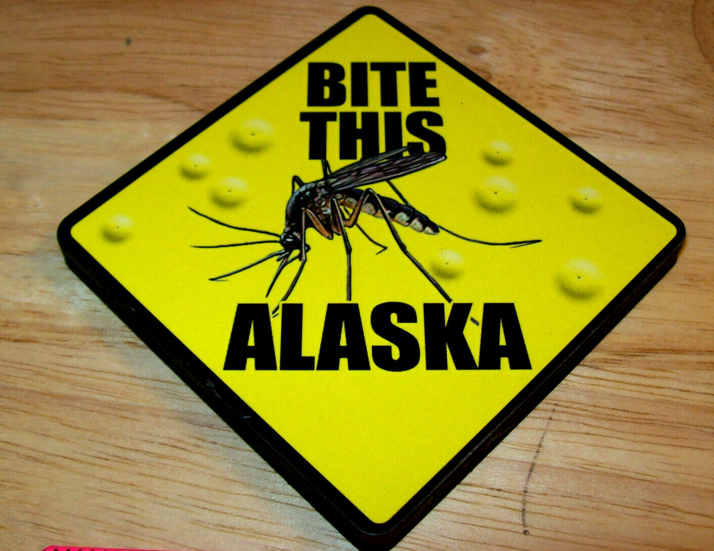 Alaska Magnet Bite This with Mosquito in the style of a crossing sign ...