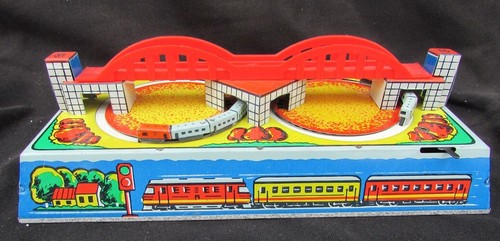 Tin wind up toy dual miniature trains plastic bridge works no key or ...