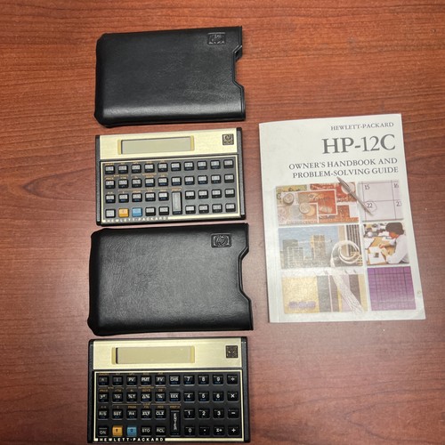 lot 2 HP 12C financial calculator with sleeves and 1 manual both are ...