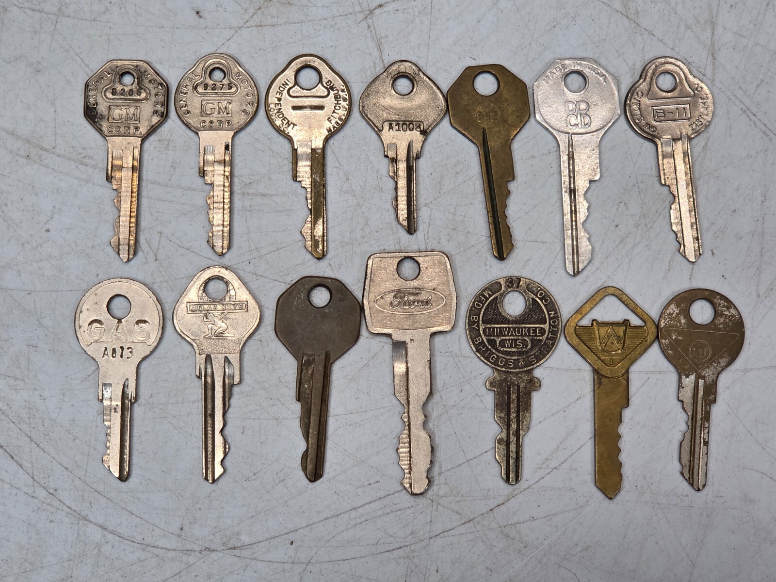 Lot of 14 mixed automobile car keys door keys gas keys GM Ford and more ...