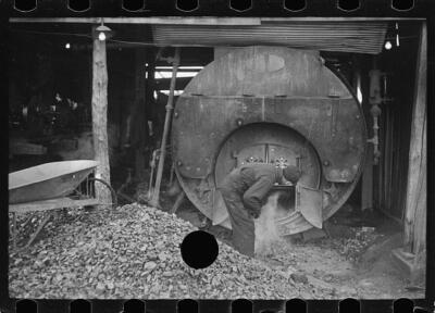 Stoking furnace at gopher hole Williamson County Illinois 1930s Old ...