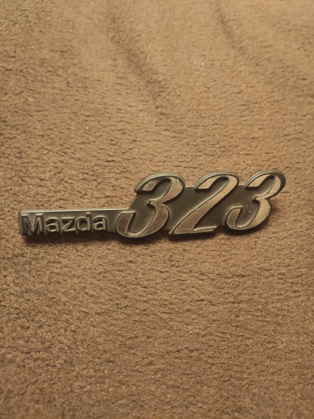 mazda 323 familia fa4 1977 bug eye boot badge | eBay