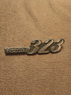 mazda 323 familia fa4 1977 bug eye boot badge | eBay