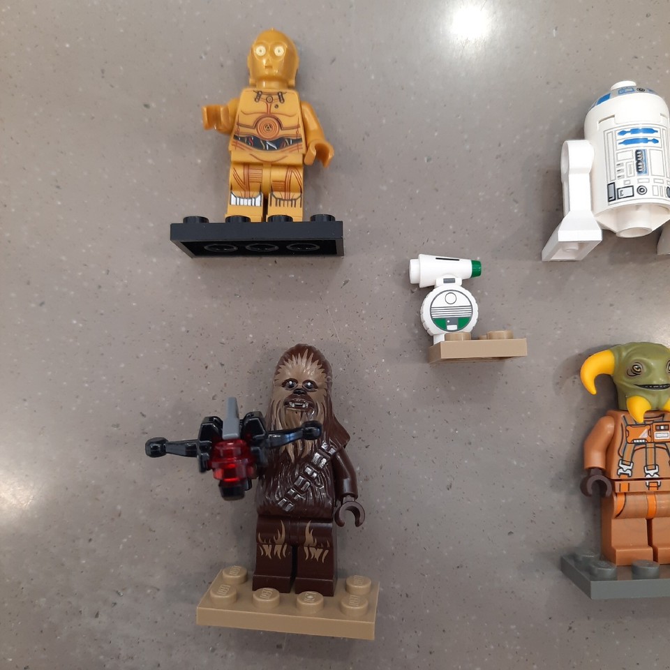 Lego Star Wars Millenium Falcon 75257. [5] Figures. BOOLIO, C-3PO, R2D2 ...