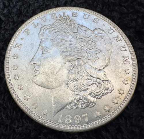 Hi grade BU 1897 Morgan silver dollar. Great breast feathers and ...