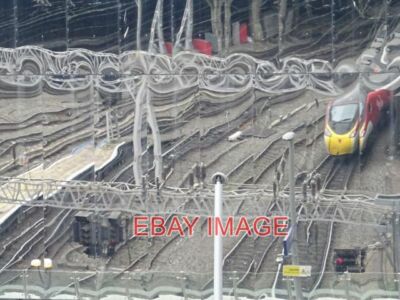PHOTO REFLECTIONS ON NEW STREET STATION REFLECTIONS OF A TRAIN ARRIVING ...