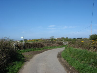 Photo 6x4 Bend in the road and footpath-road junction east of Foel bach ...