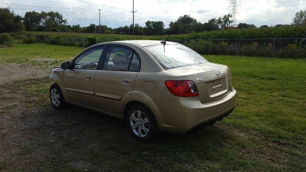 Gold Kia Rio 2006 Pictures