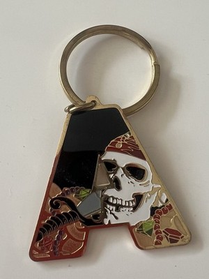 Pirates of the Caribbean Disneyland initial keychain | eBay