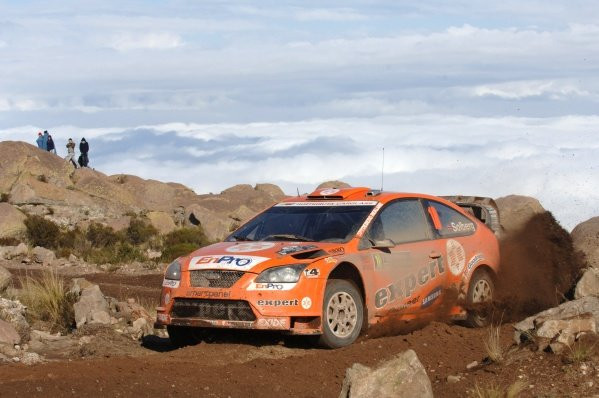 Henning Solberg (NOR) Ford Focus WRC above the clouds on stage 21 2007 ...