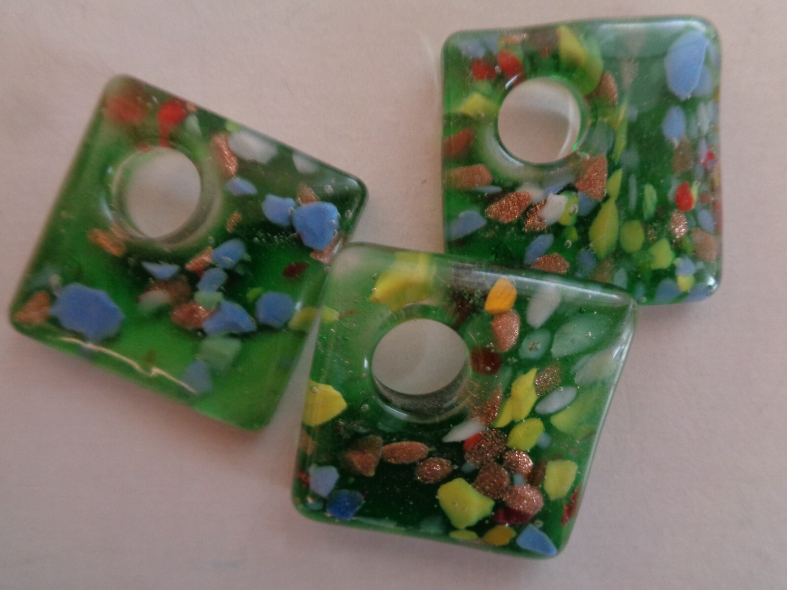 Focal, Lampworked glass, clear green with color array of color specks ...